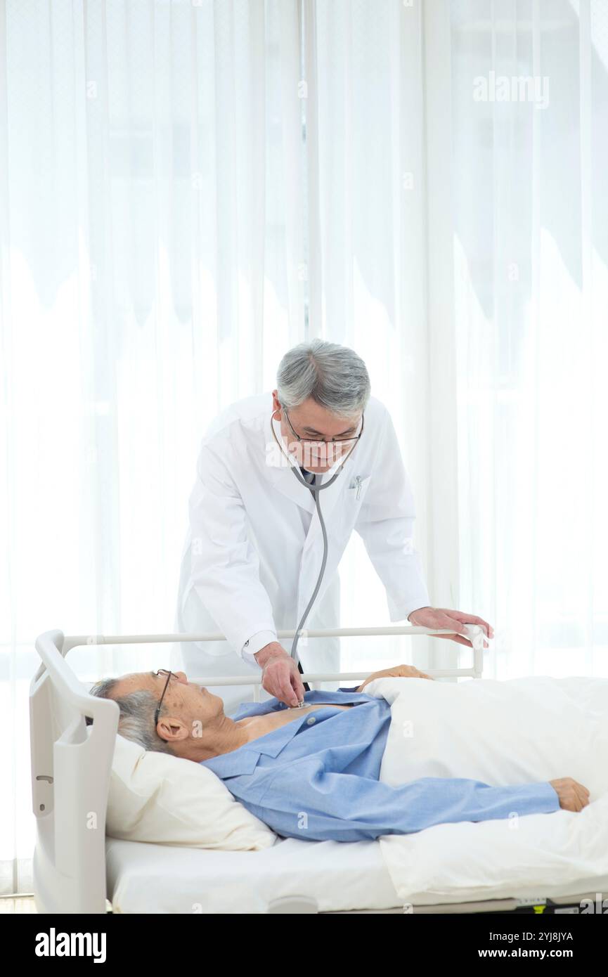 Old man doctor in white hi-res stock photography and images - Alamy