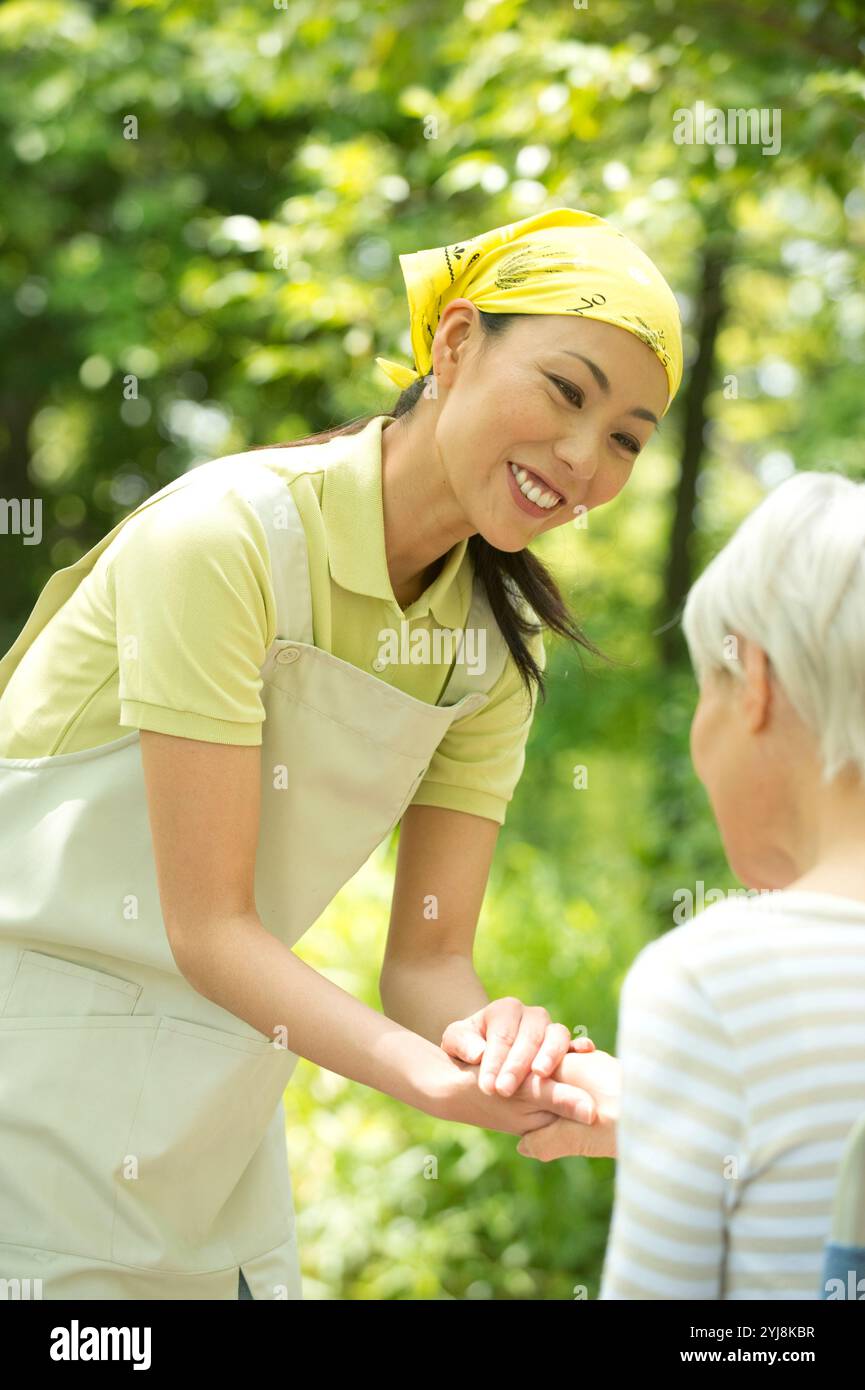 Old man in wheelchair and care helper Stock Photo - Alamy