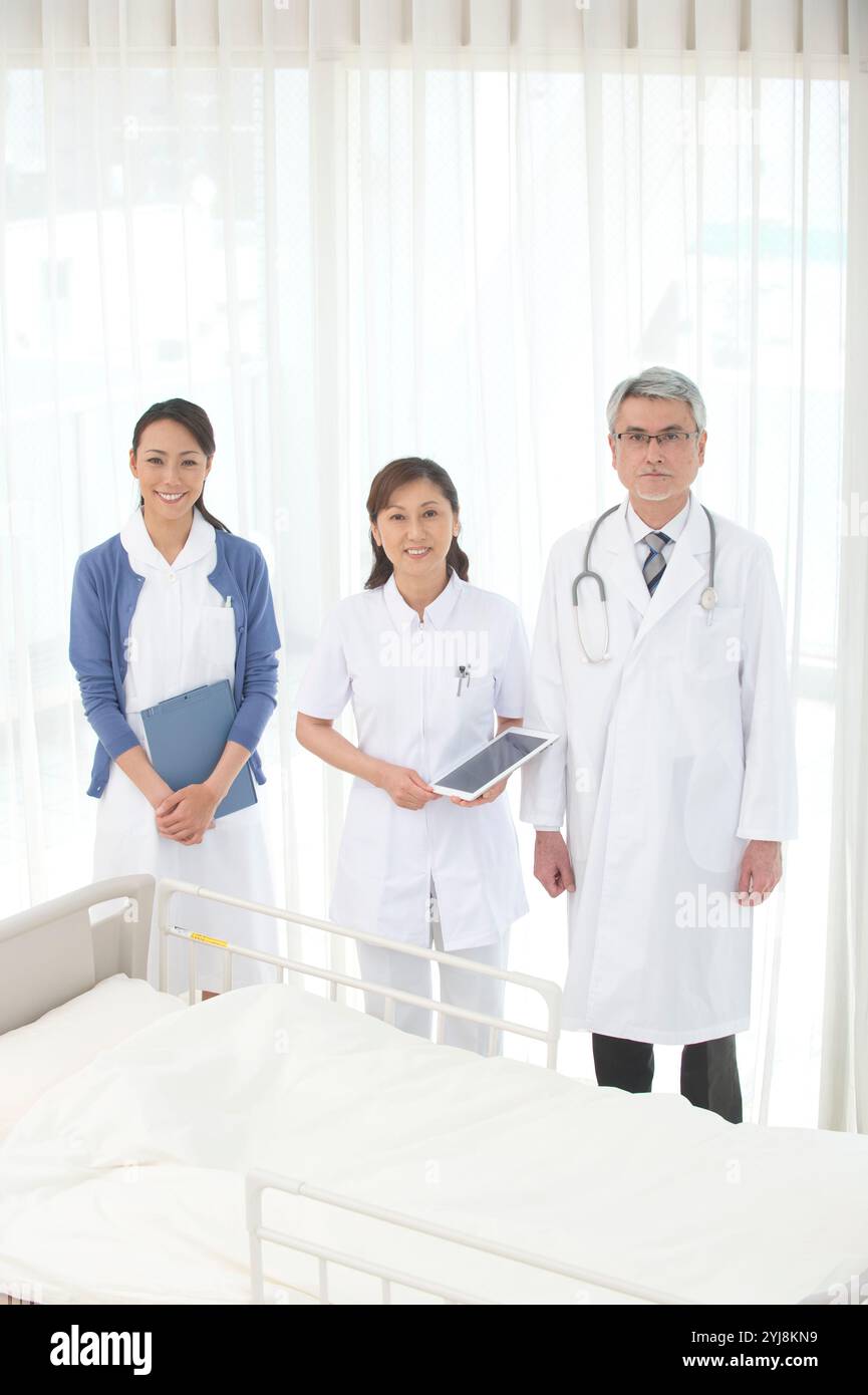 Female doctor standing bed in hi-res stock photography and images - Alamy