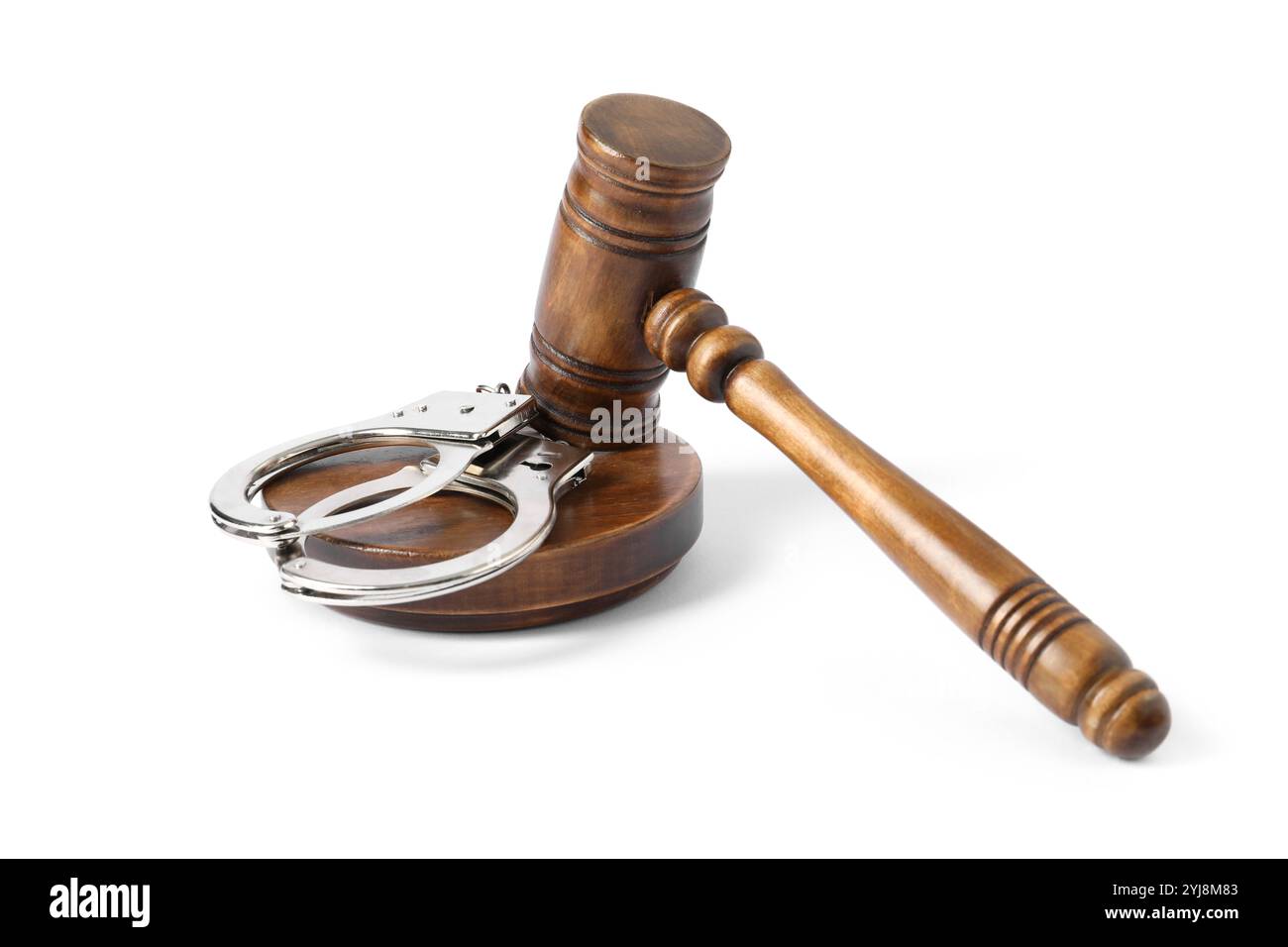 Handcuffs and judge's gavel isolated on white Stock Photo - Alamy