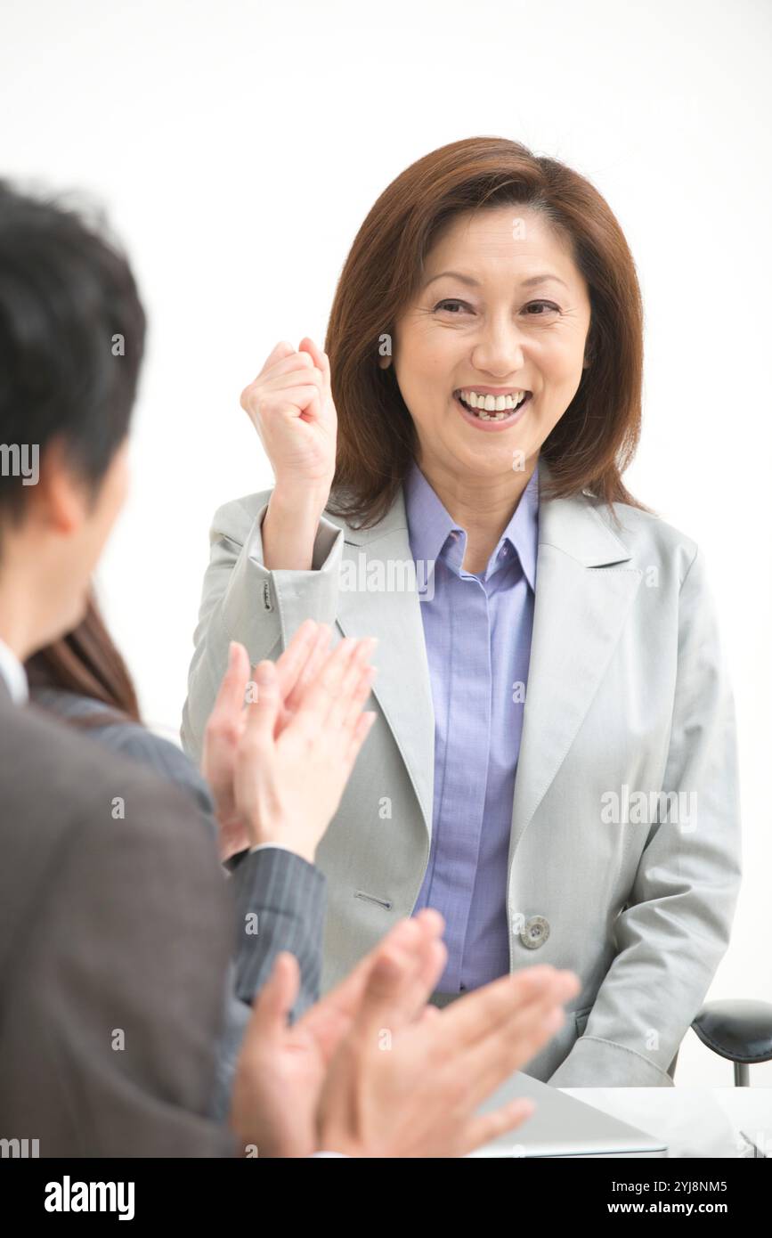 Business person clapping and female boss Stock Photo - Alamy