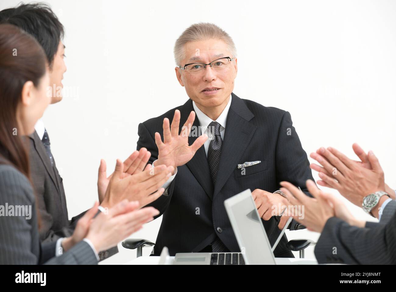 Business people clapping and their bosses Stock Photo - Alamy