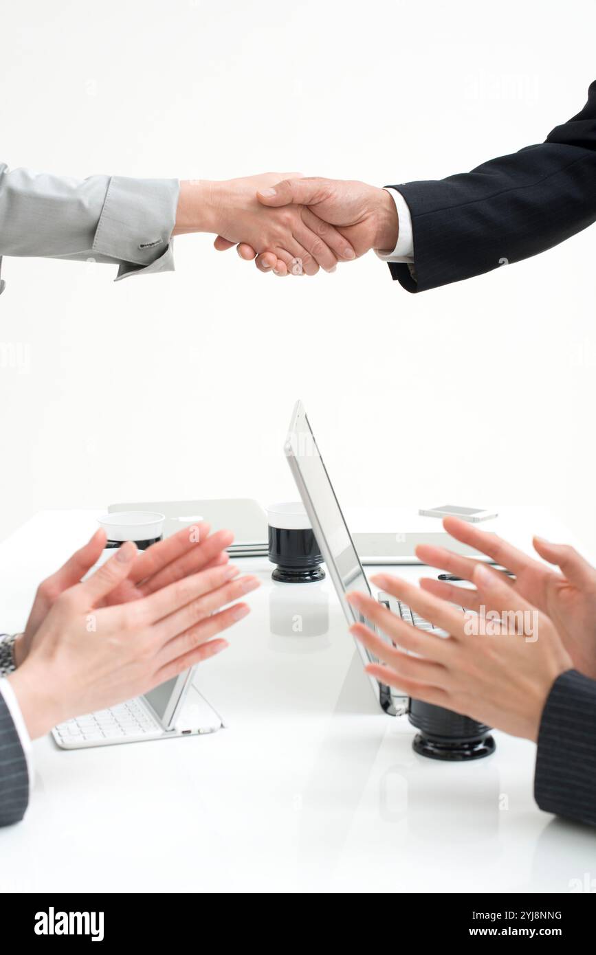 Businessperson clapping hands shaking hands Stock Photo - Alamy