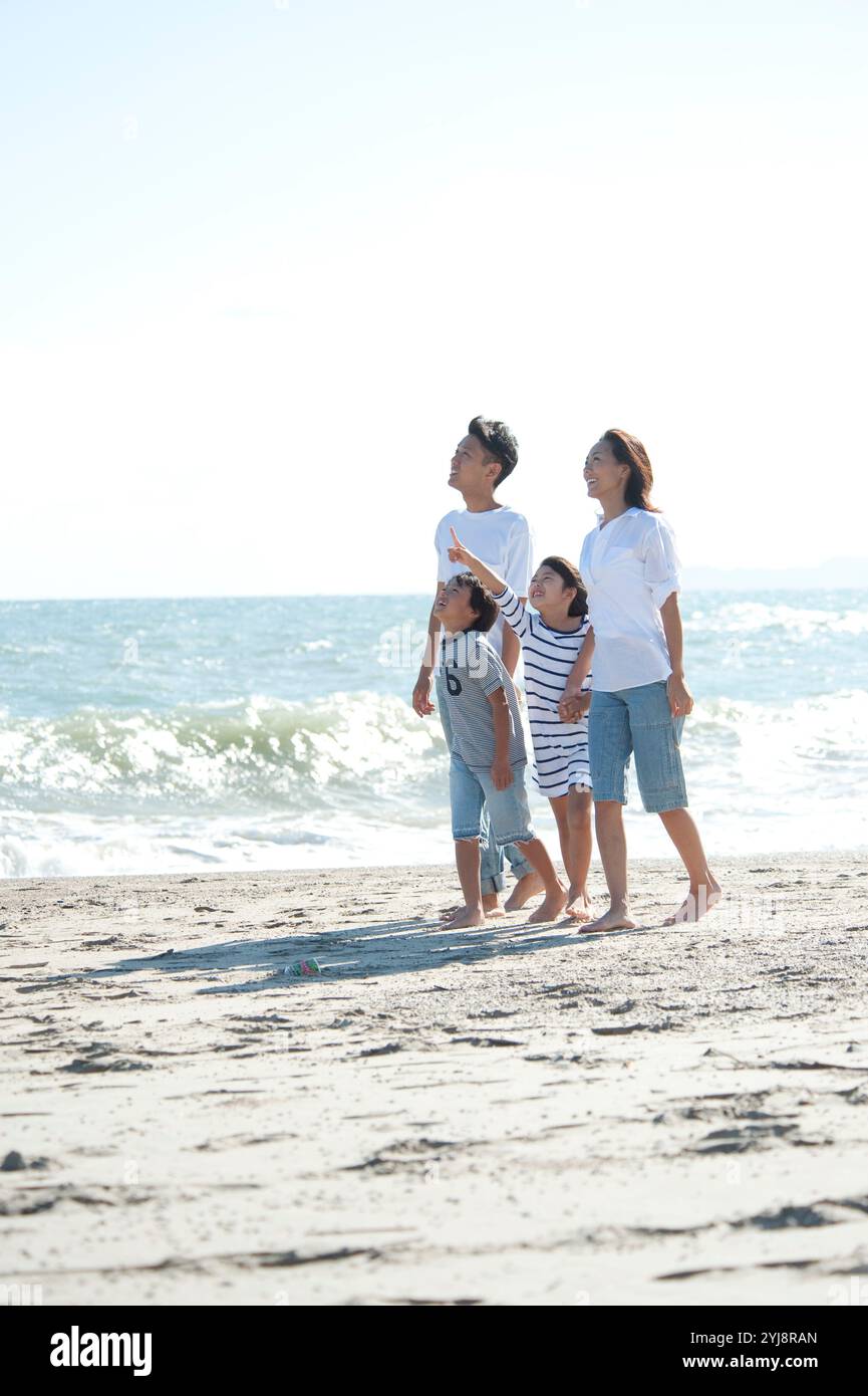 Family on the seaside Stock Photo - Alamy