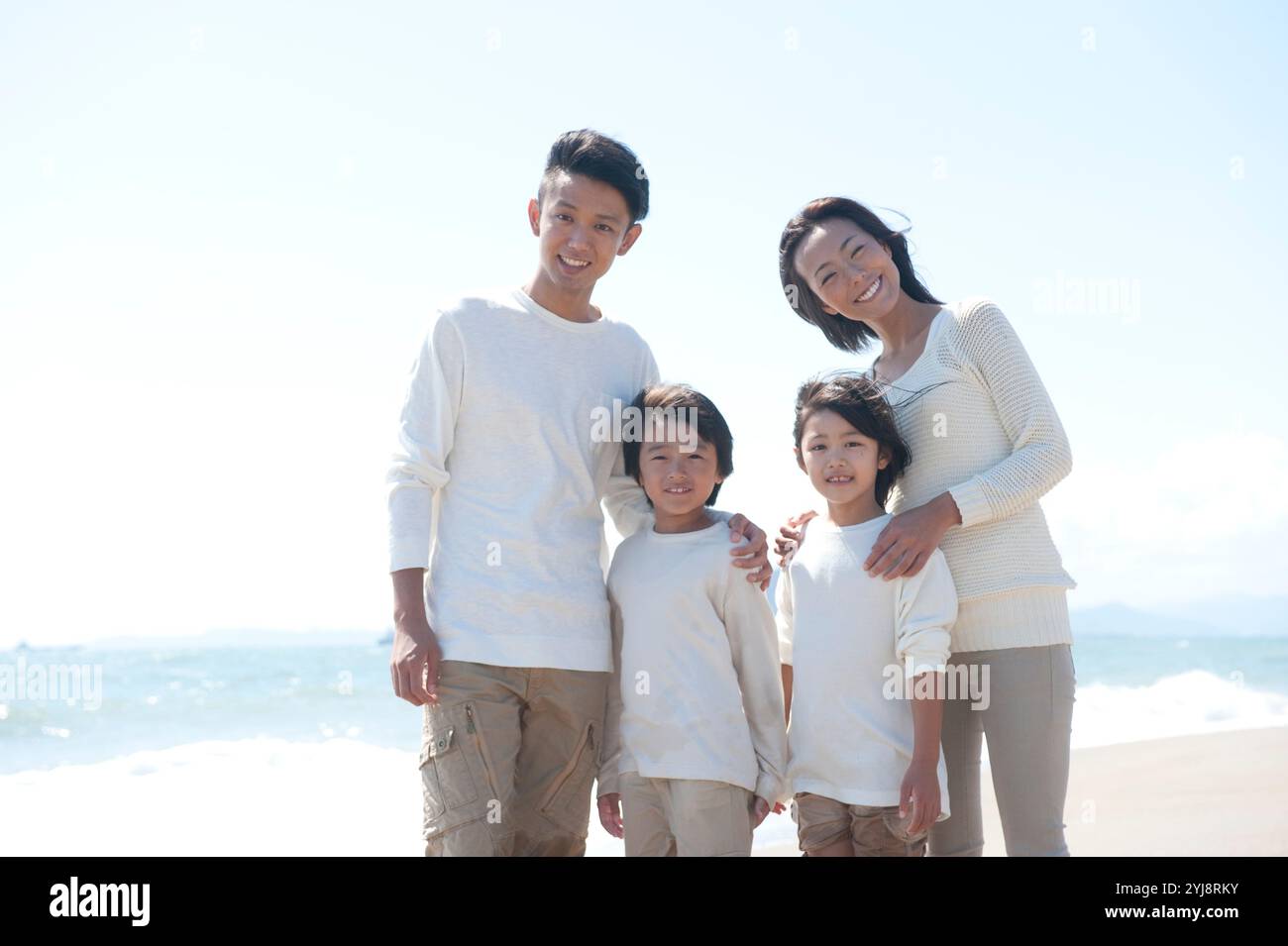 Family on the seaside Stock Photo - Alamy