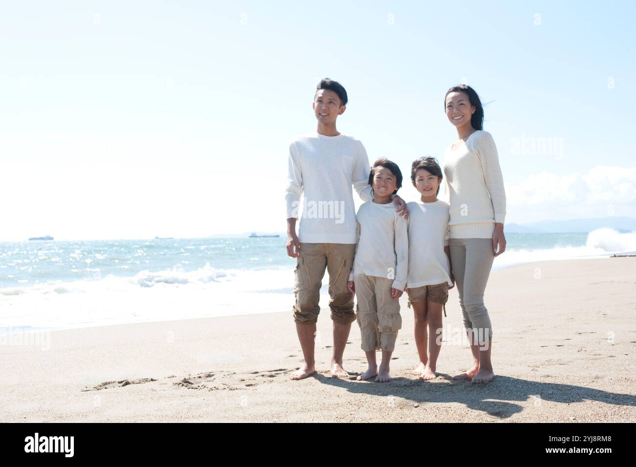 Family on the seaside Stock Photo - Alamy