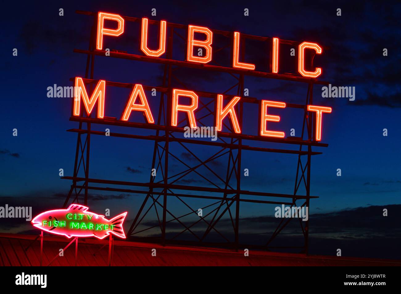 The large neon lights sign of the Public Market and fish market is ...