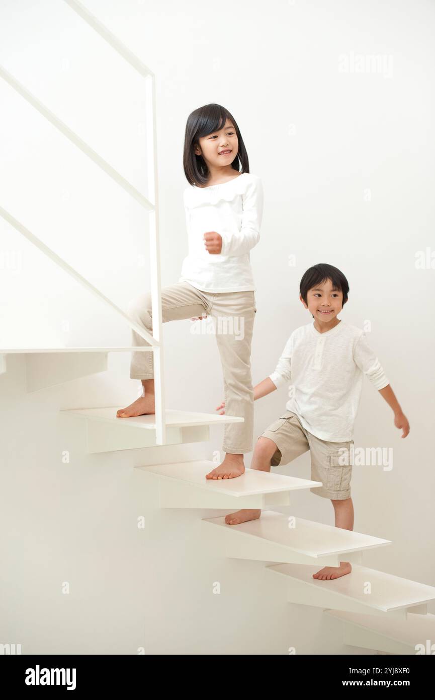 Child going up stairs hi-res stock photography and images - Alamy