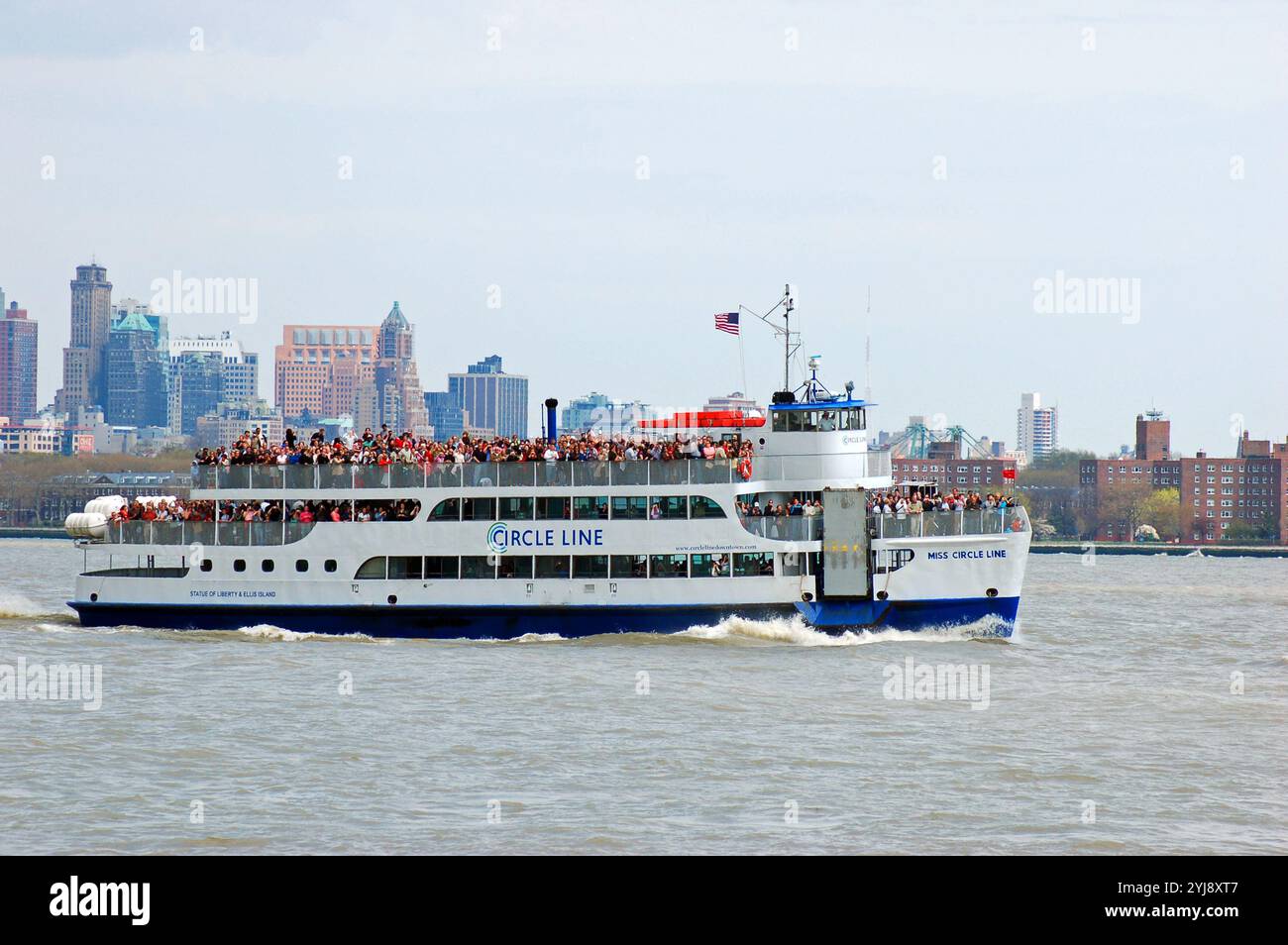 The Circle Line Ferry leads tourists on a guided tour boat ride around ...