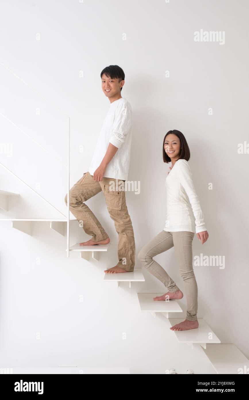 Man woman stairs climbing hi-res stock photography and images - Alamy