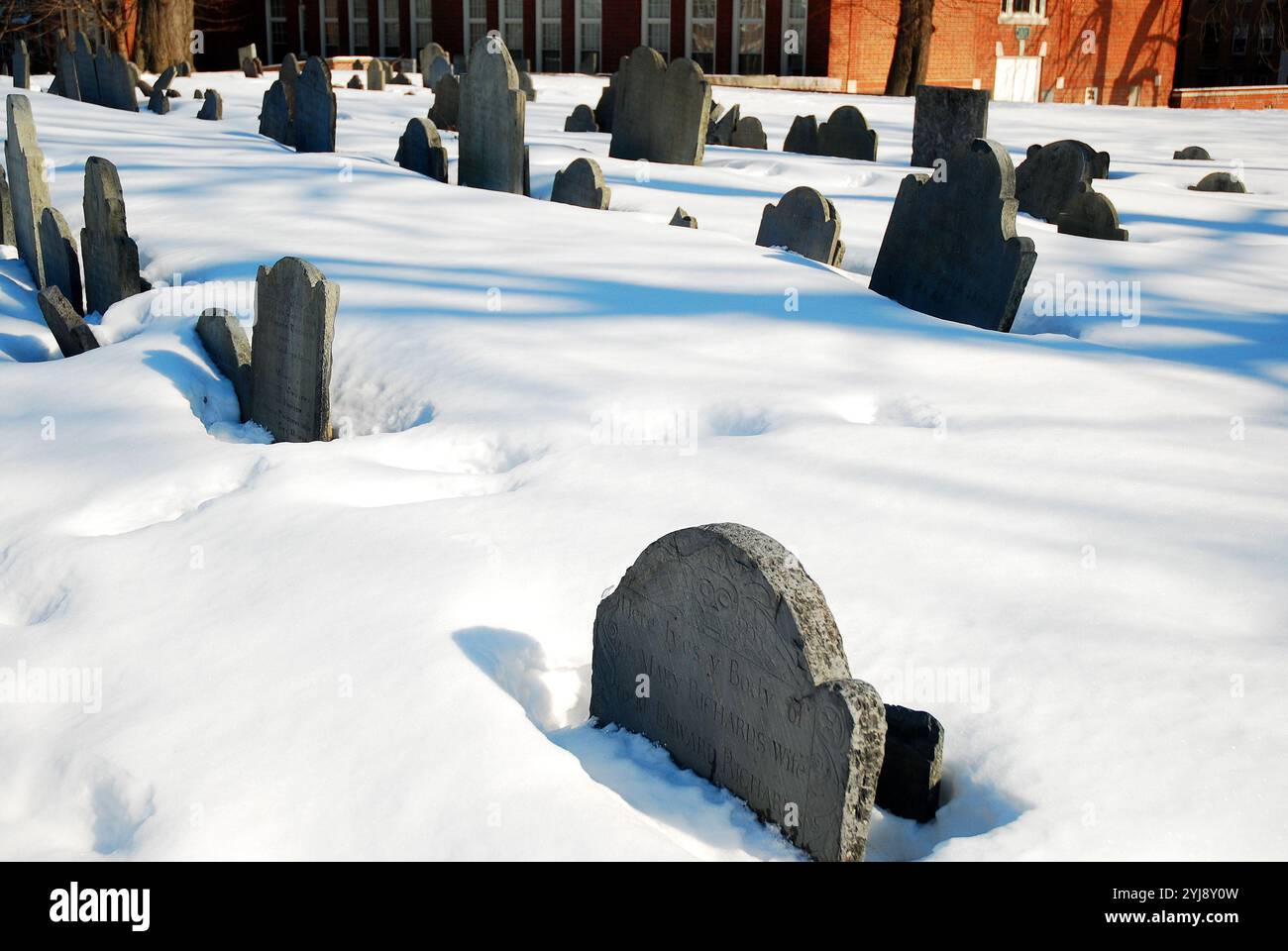 Snow covers the historic Copps Burial Ground in Boston, holding graves ...