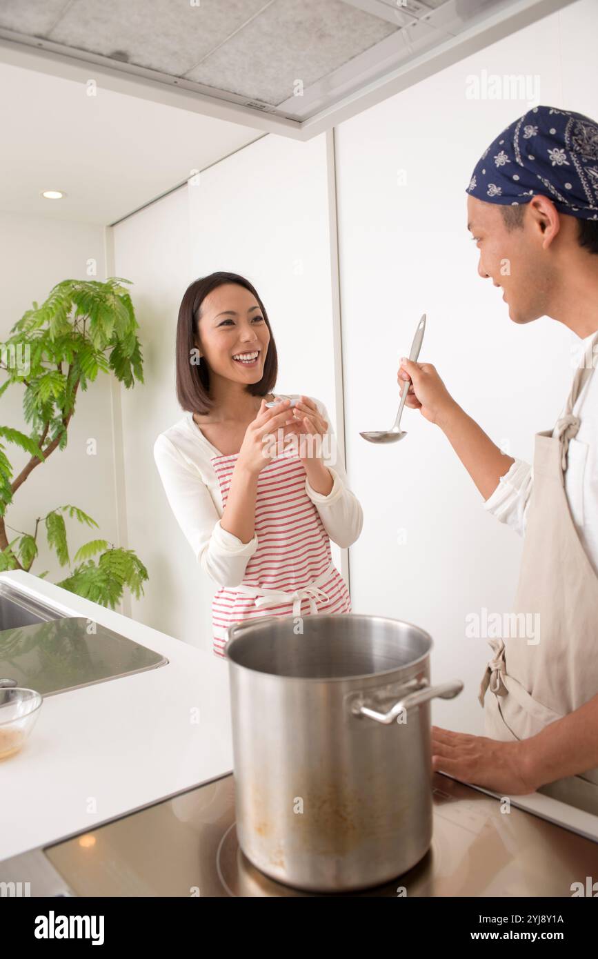 Back view woman cooking in kitchen hi-res stock photography and images ...