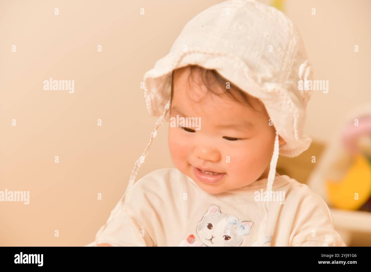 Toddler looking at a picture book Stock Photo - Alamy