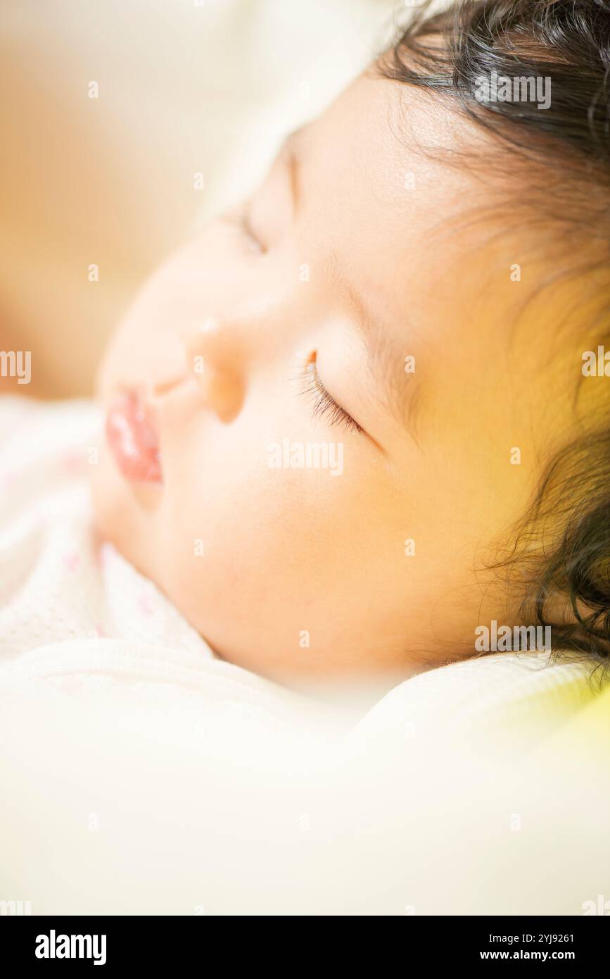 Baby girl sleeping face Stock Photo - Alamy