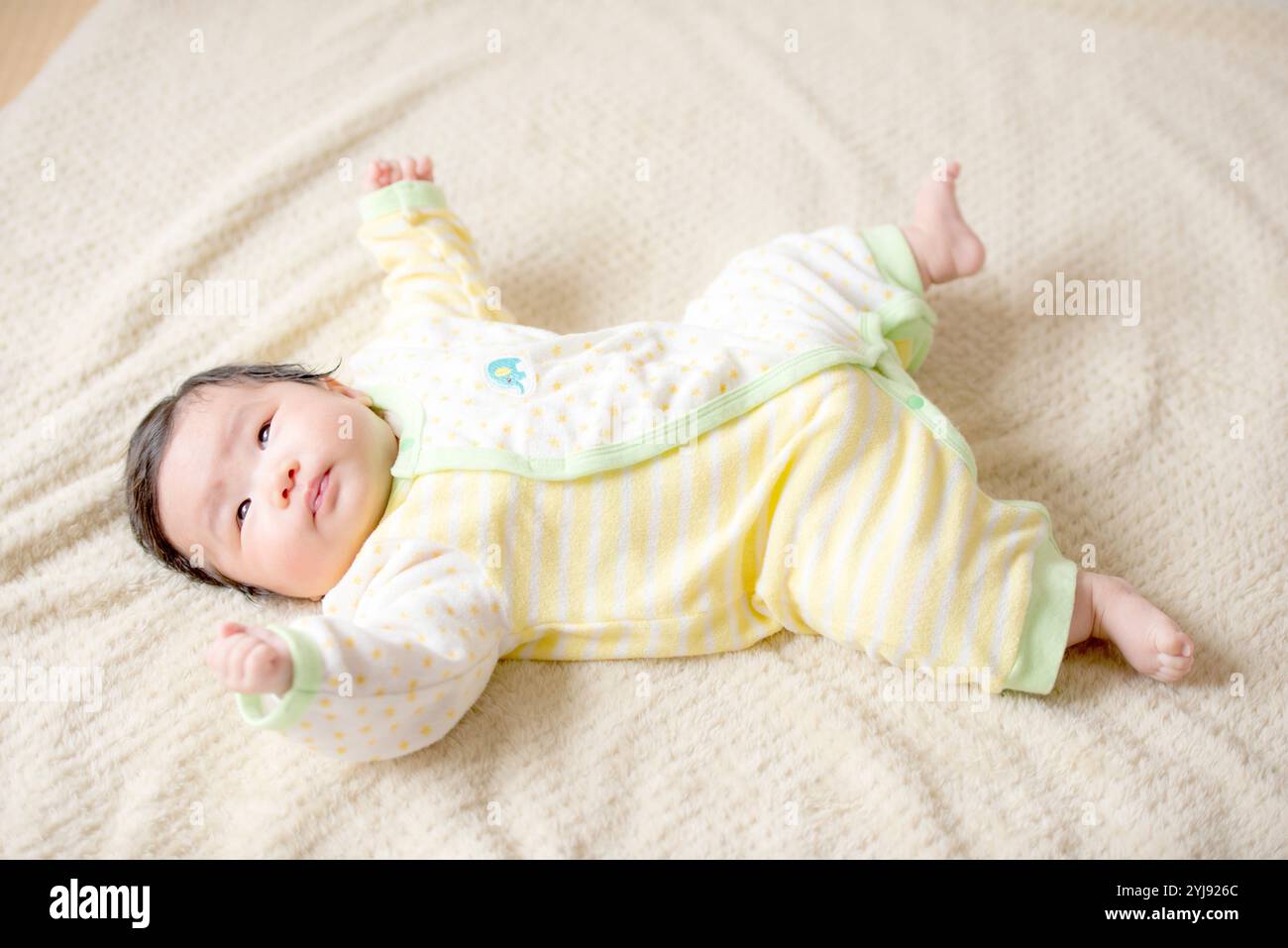 Three-month-old baby moving his/her arms and legs vigorously Stock ...