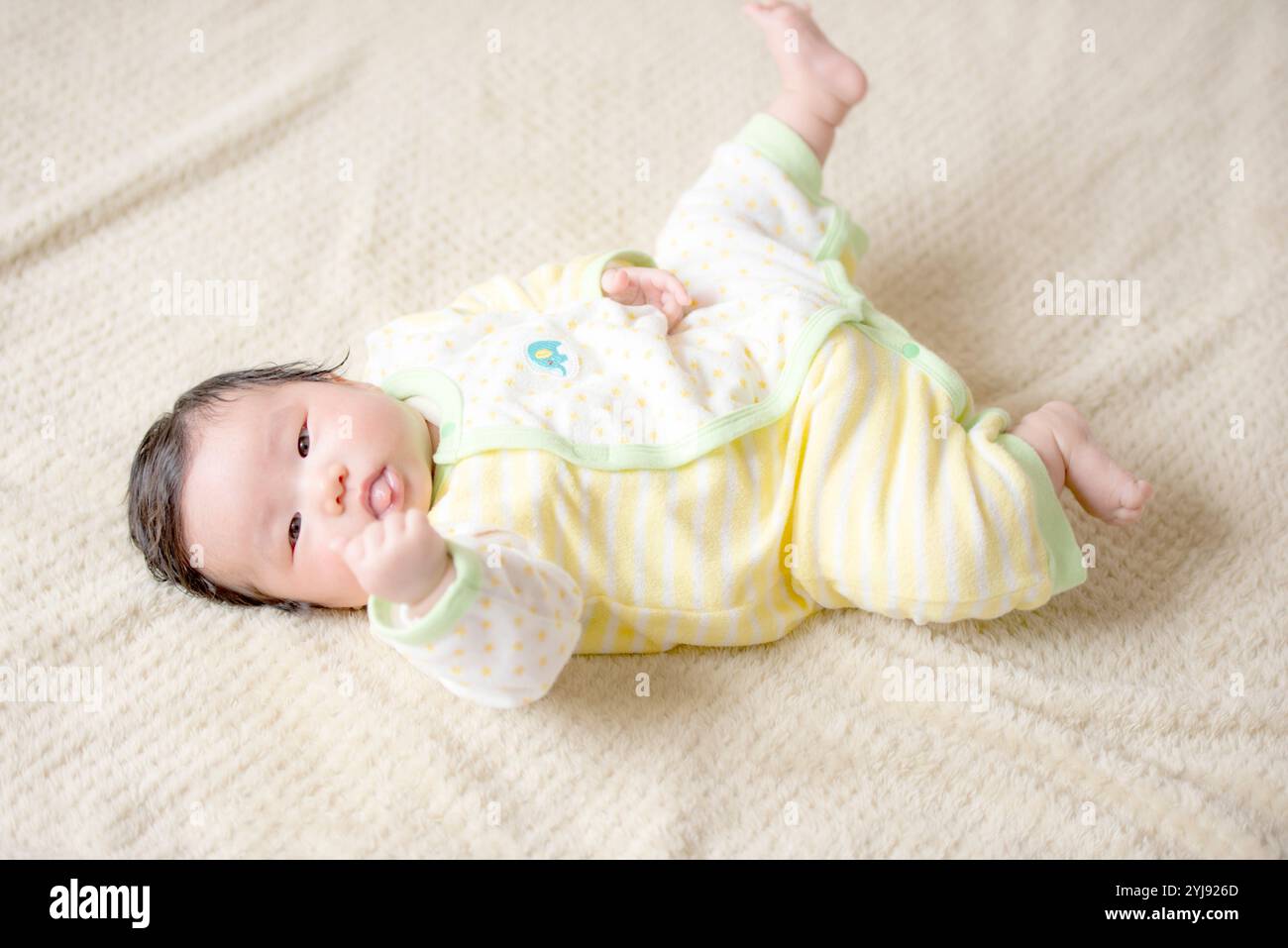 3-month-old infant moving limbs vigorously Stock Photo - Alamy