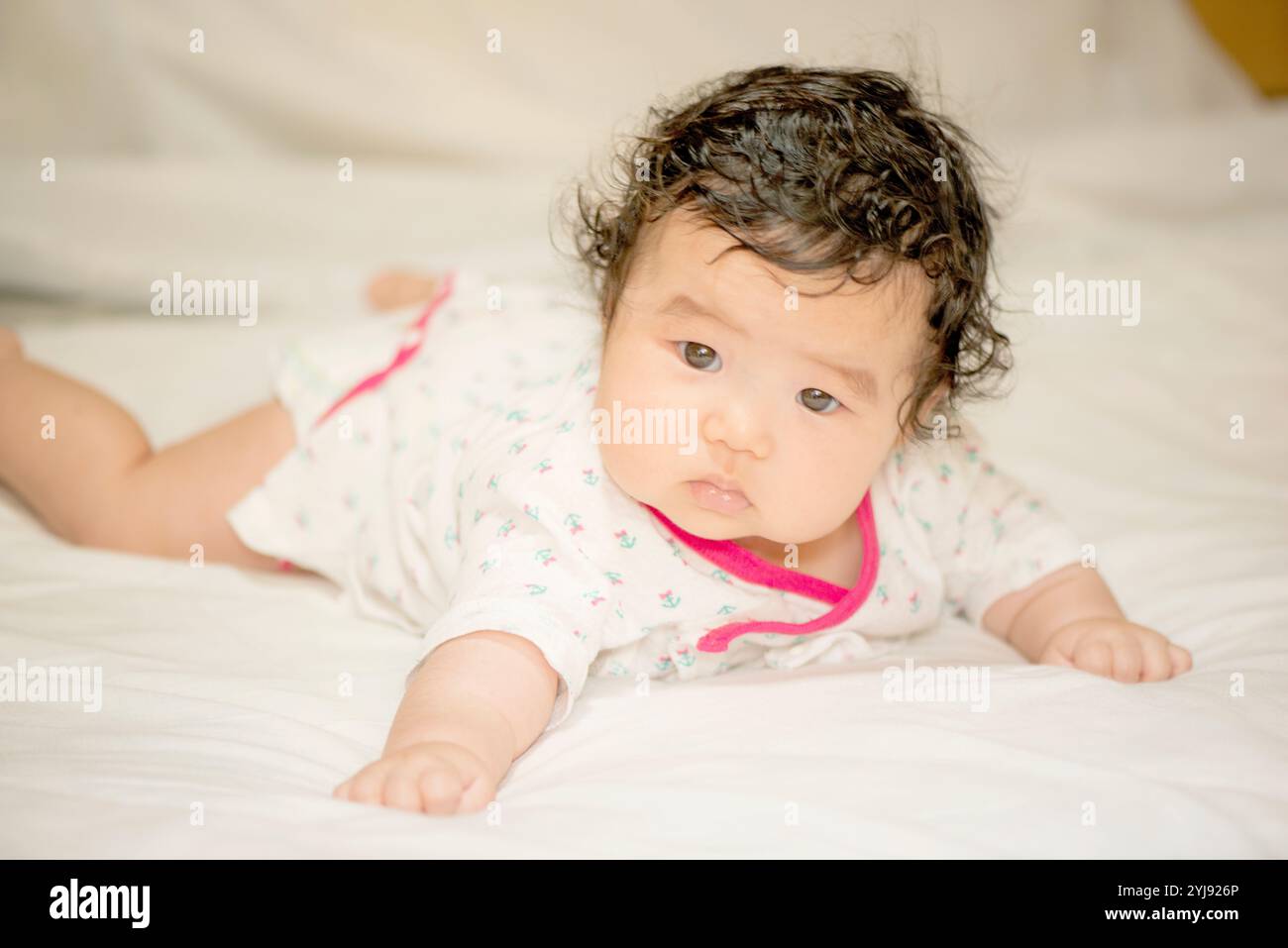Four-month-old baby staring at lens Stock Photo - Alamy