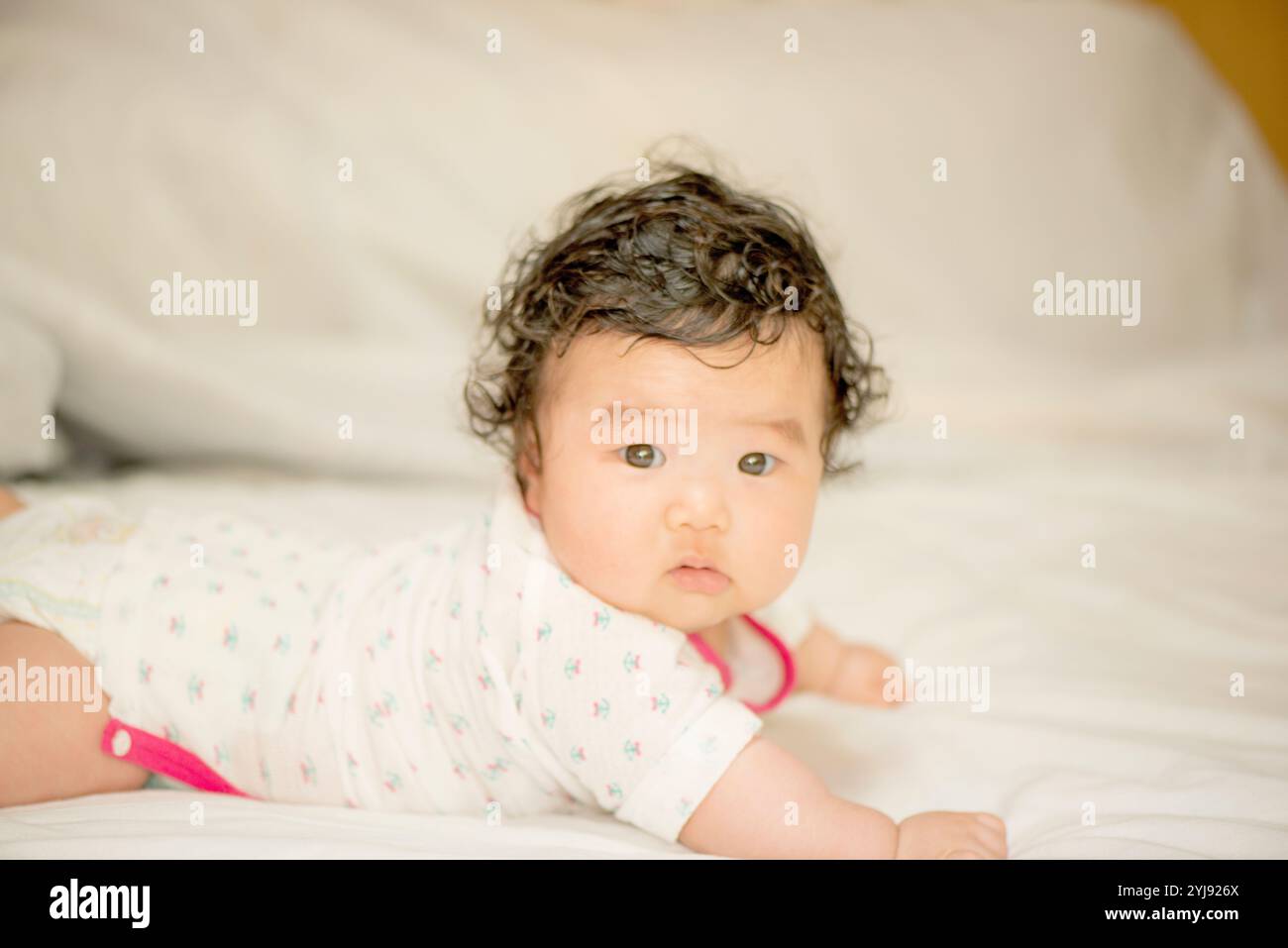 4 months old Baby looking through lens Stock Photo - Alamy