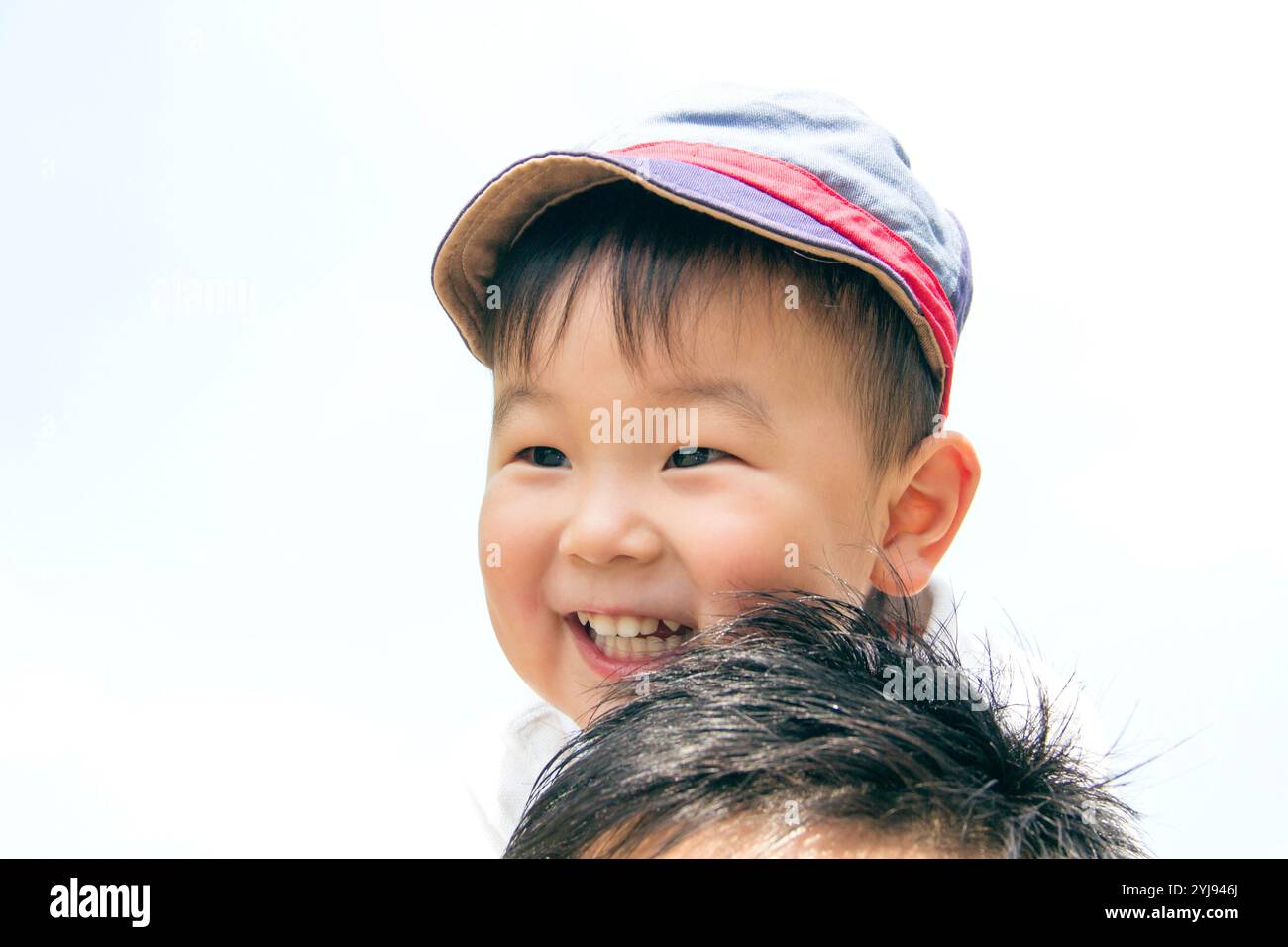 Boy happy to be given a shoulder lift Stock Photo - Alamy