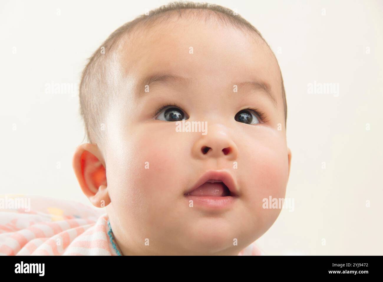 Baby staring at something Stock Photo - Alamy