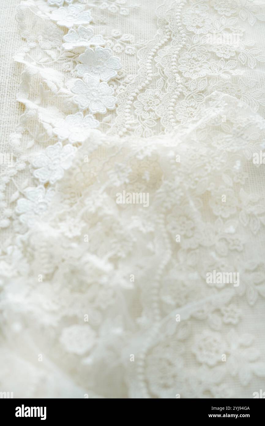 Overlapping white lace Stock Photo - Alamy