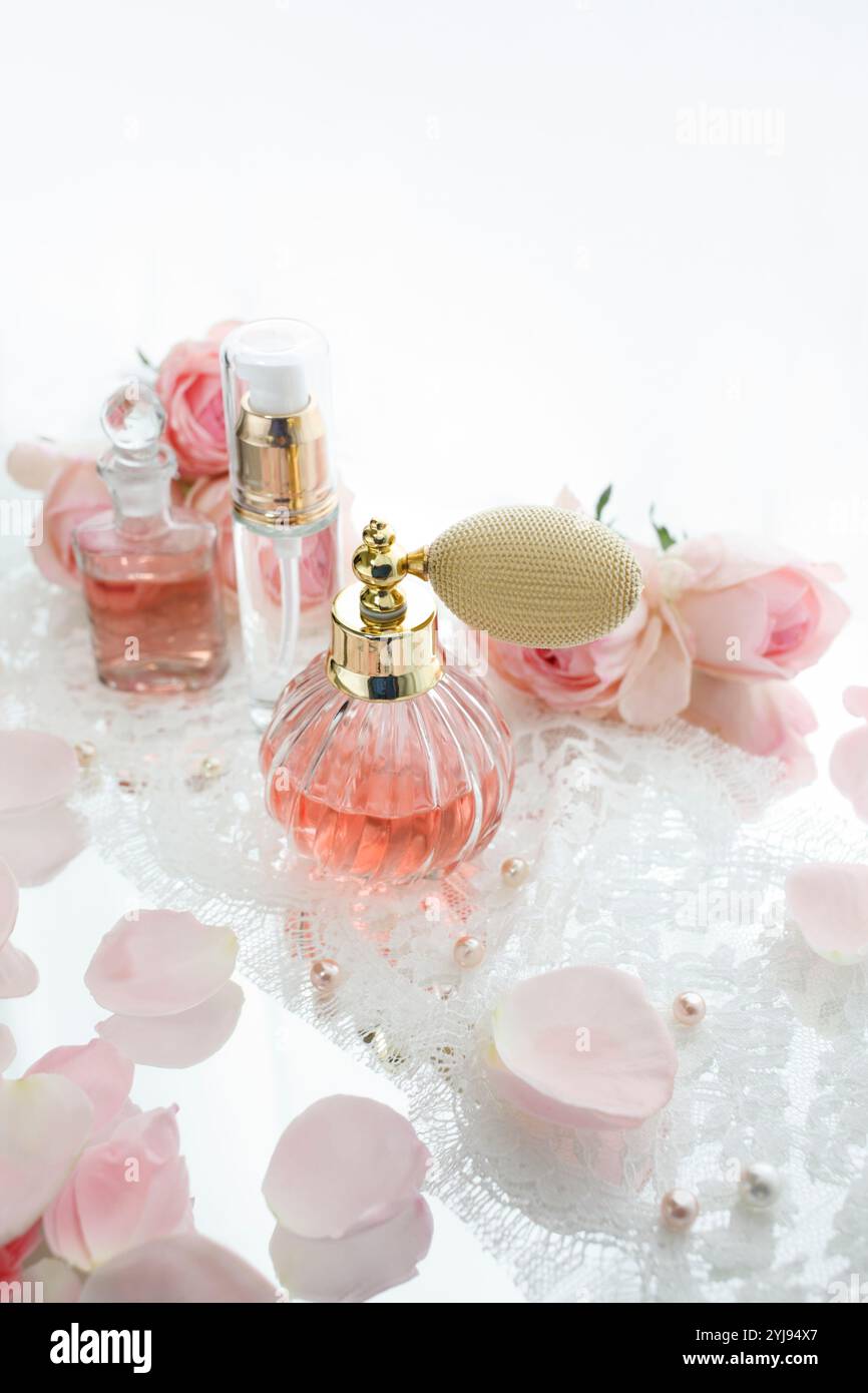 Classic perfume bottle, roses and lace Stock Photo - Alamy