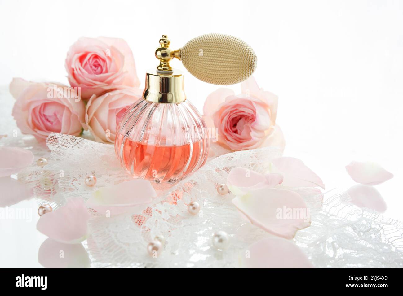 Classic perfume bottle, roses and lace Stock Photo - Alamy