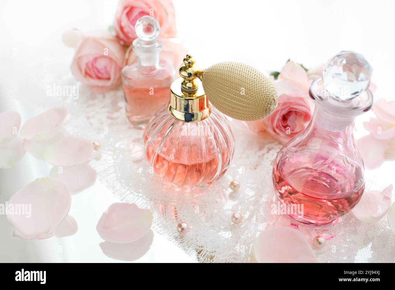Classic perfume bottle, roses and lace Stock Photo - Alamy