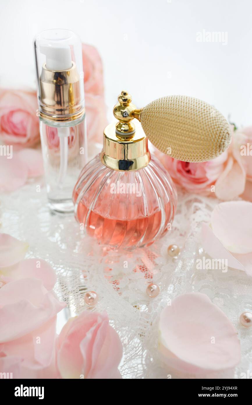 Classic perfume bottle, roses and lace Stock Photo - Alamy