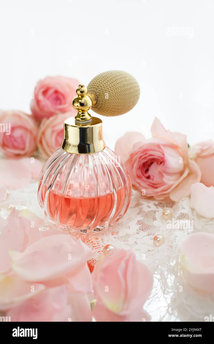 Classic perfume bottle, roses and lace Stock Photo - Alamy