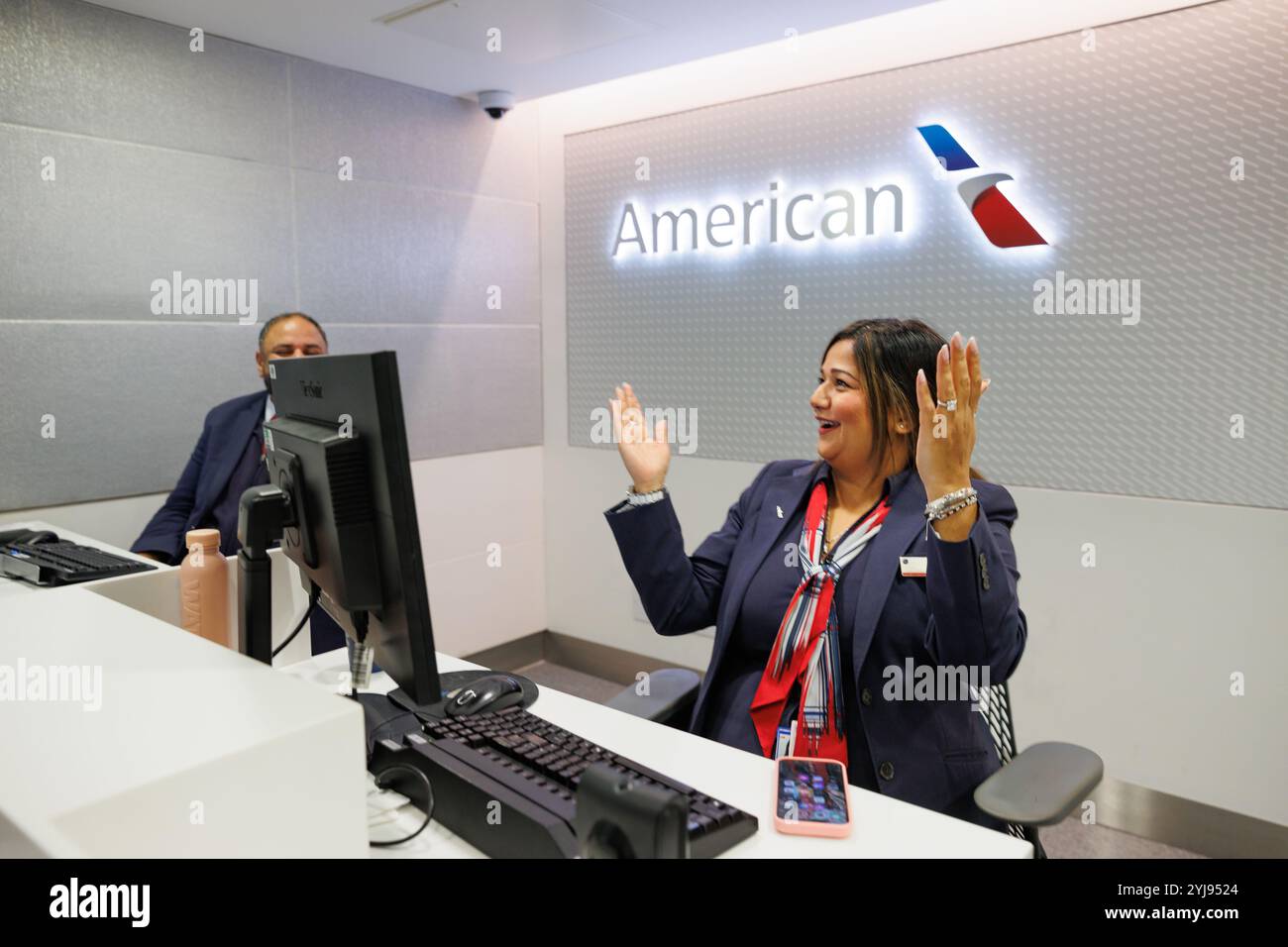 12 Nov. 2024. London, UK. Smiling American Airlines Admirals Club ...