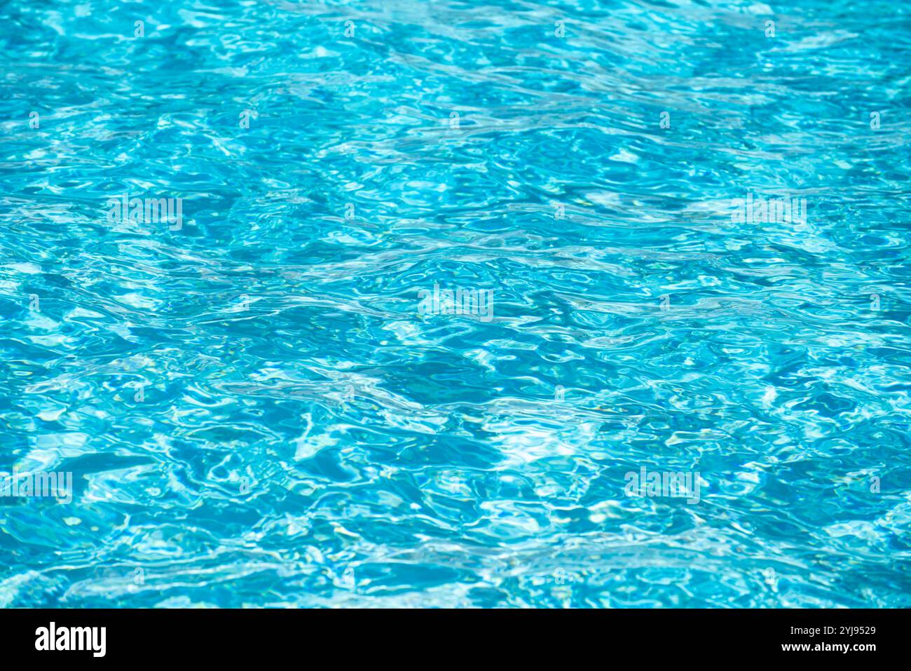 Background of blue water in swimming pool with sun reflection, ripple ...