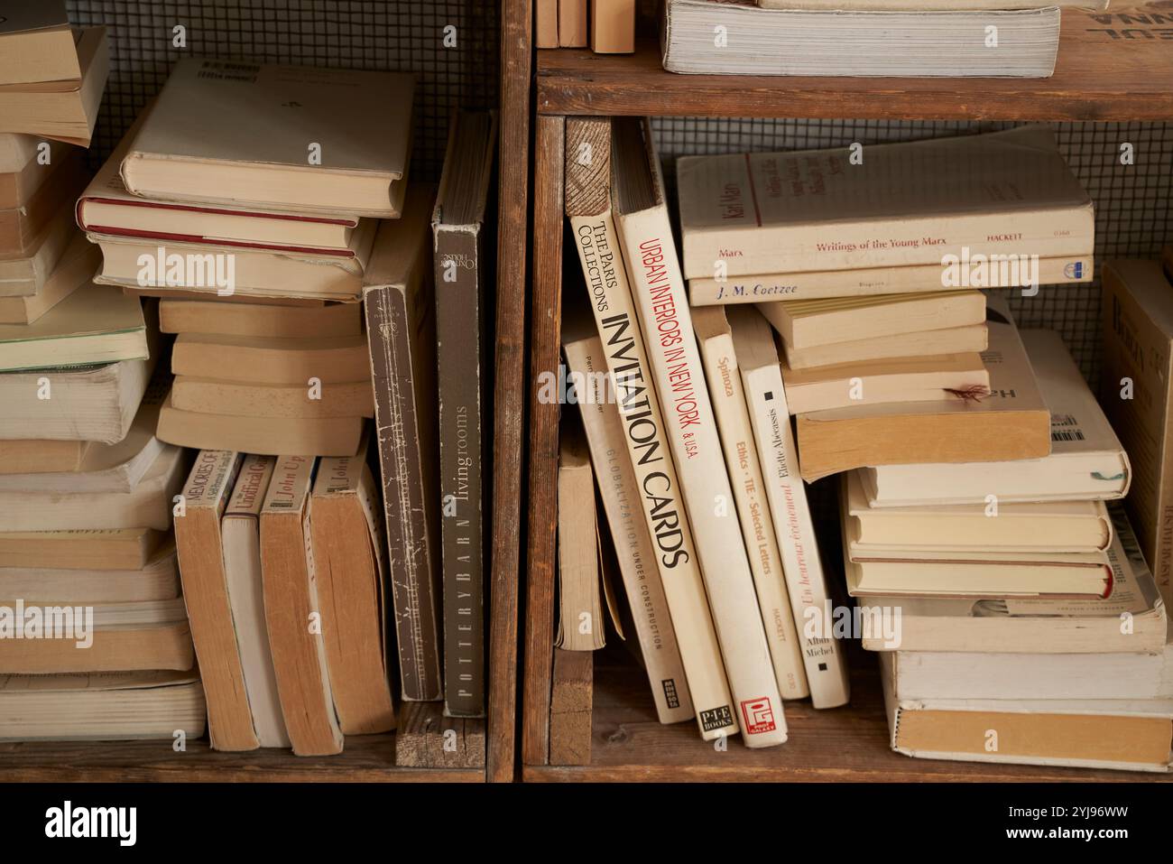 Lots of books piled up in a wooden box in a messy way Stock Photo - Alamy
