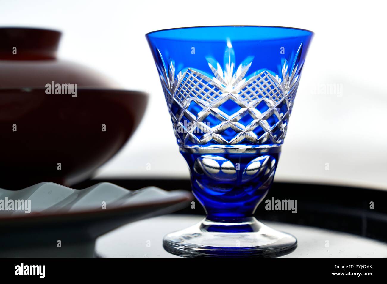 Faceted glass on black tray Stock Photo - Alamy