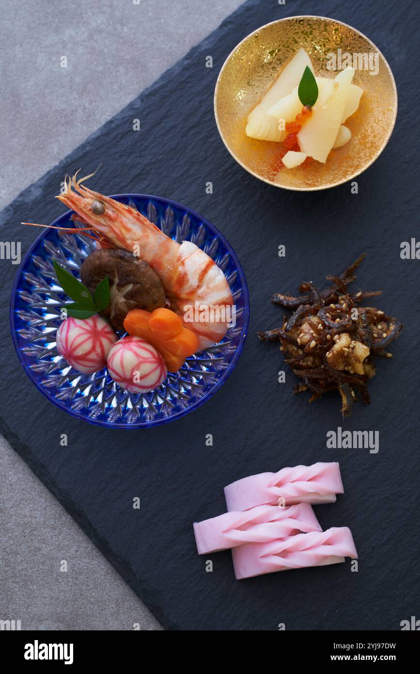 Food served in small bowls on black stone slab Stock Photo - Alamy