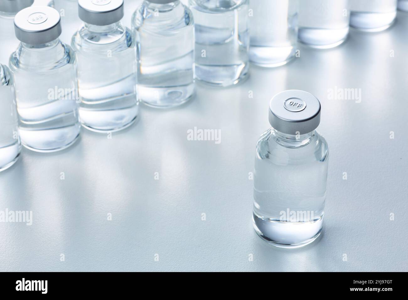 Multiple vials placed on white baking sheet Stock Photo - Alamy