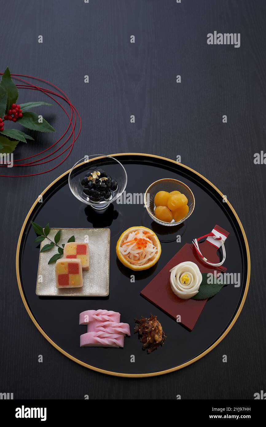 Small bowl of food on a gold-rimmed round tray with red mizuhiki and ...