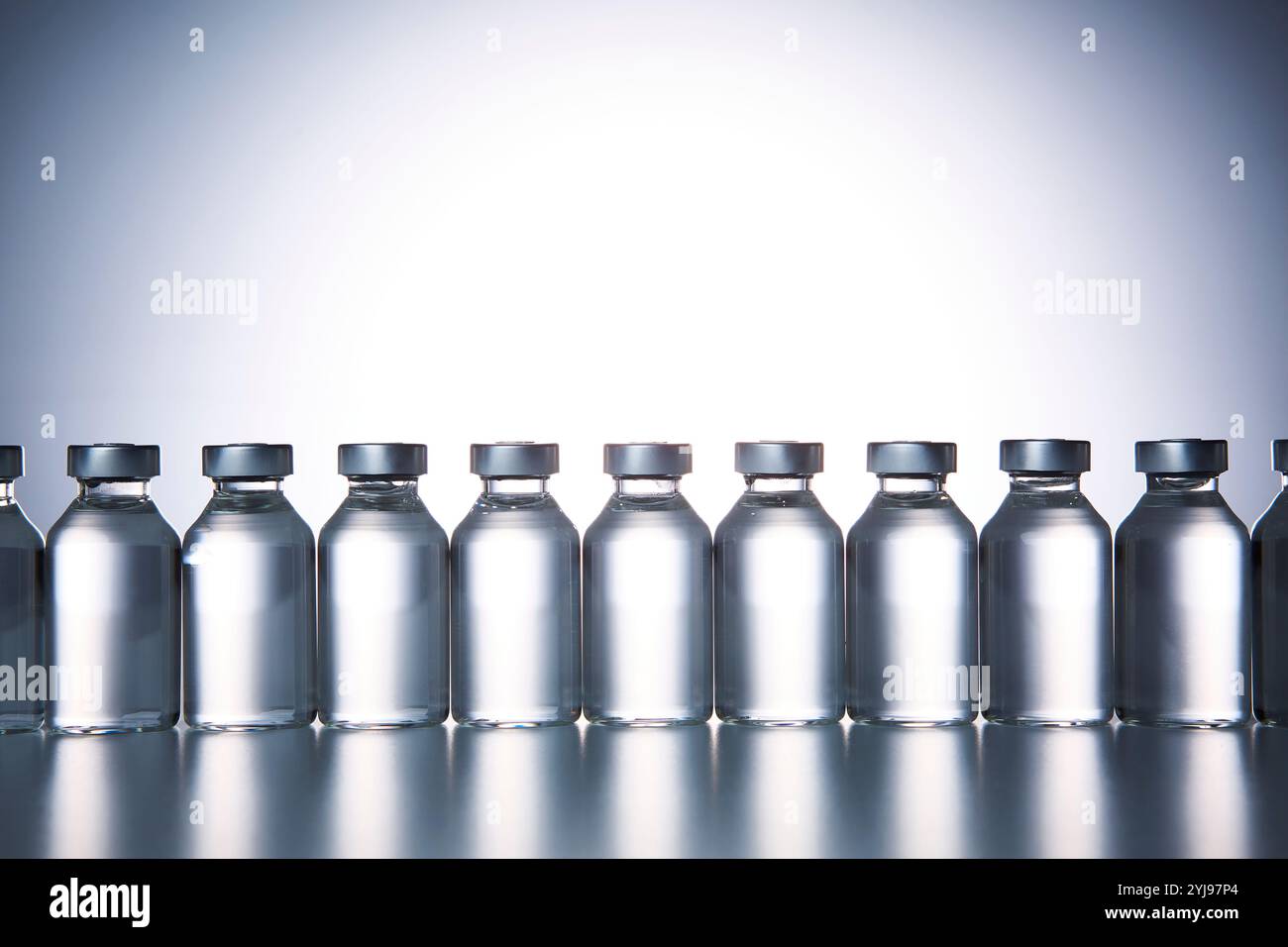 Vial bottles lined up in a horizontal row Stock Photo - Alamy