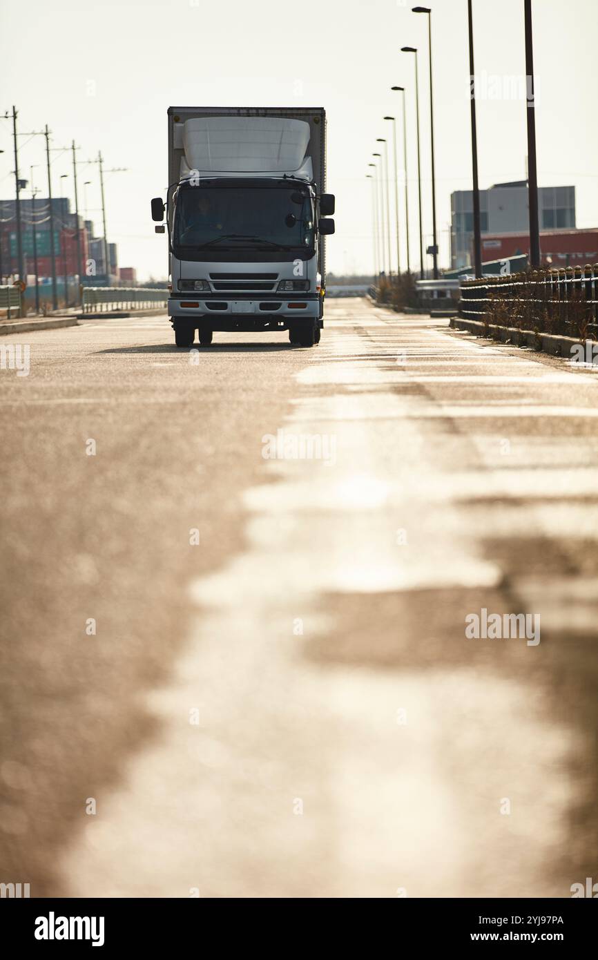 Truck running on a straight road Stock Photo - Alamy
