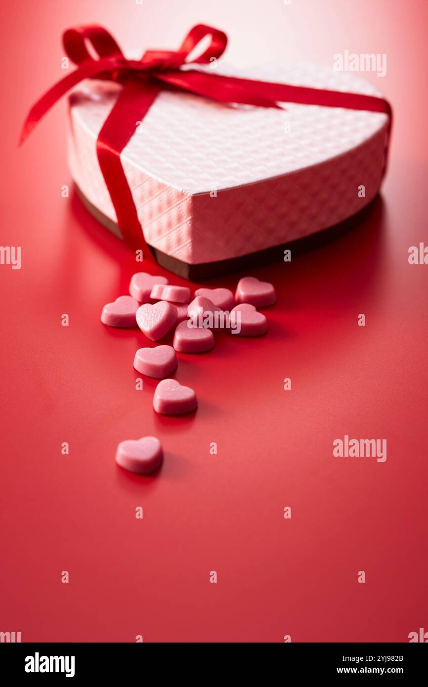 Heart-shaped box and heart chocolates Stock Photo - Alamy