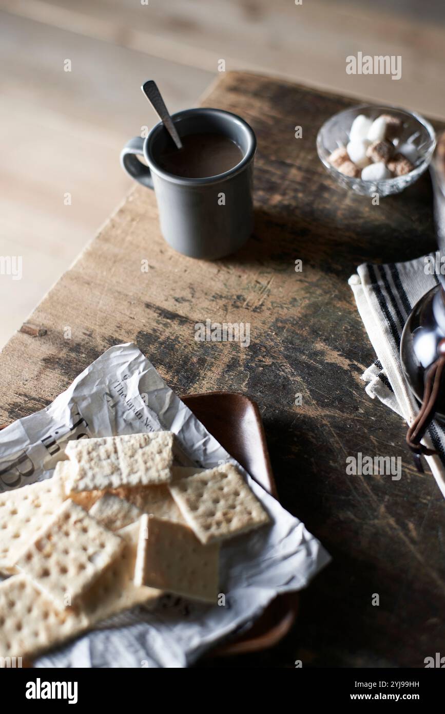 Desk with coffee and crackers Stock Photo - Alamy