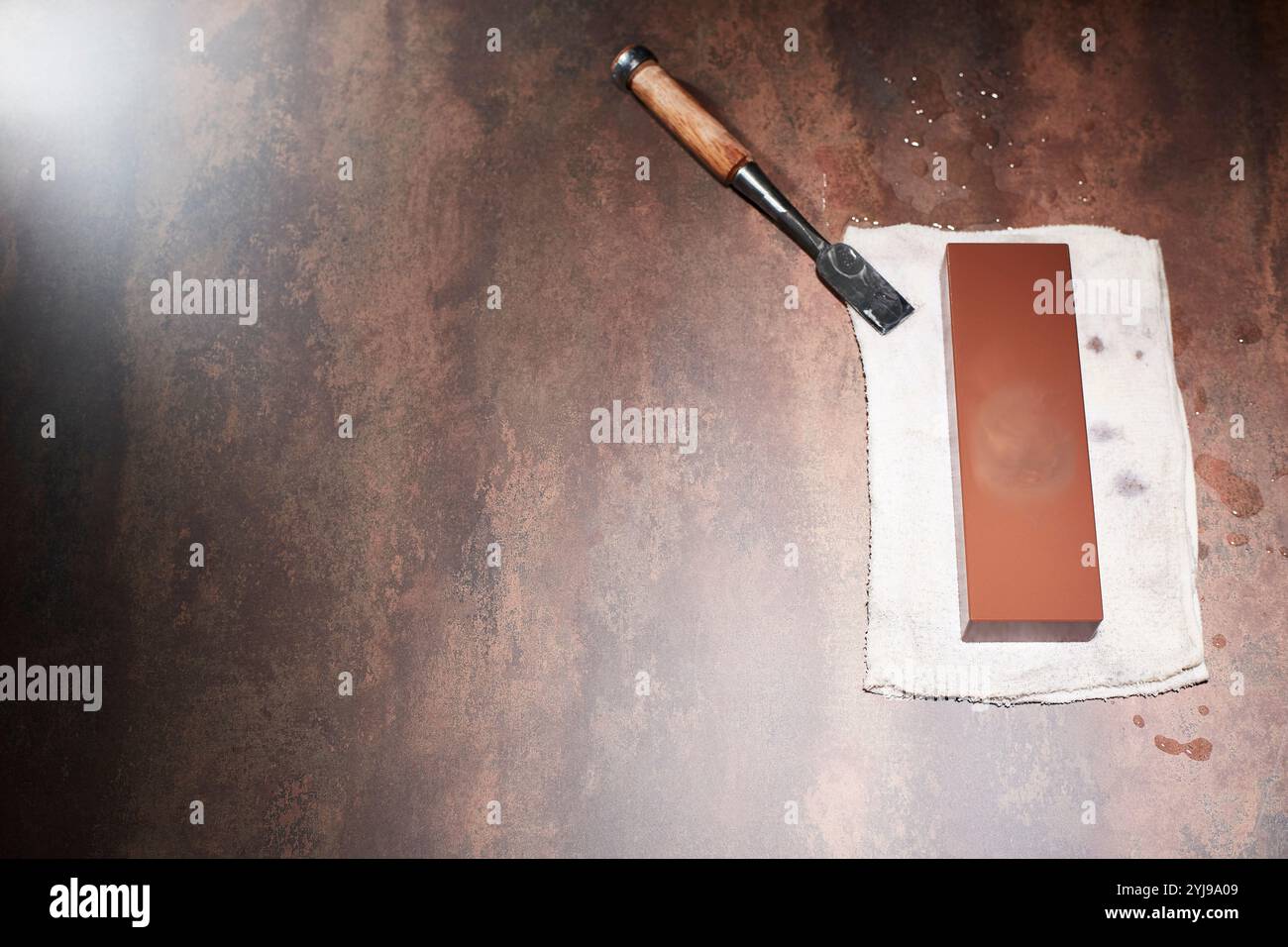 Sharpening stone and chisel on the top board Stock Photo - Alamy