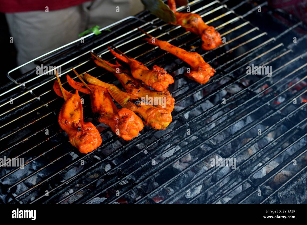 grilled chicken wings in the process of burning Stock Photo - Alamy