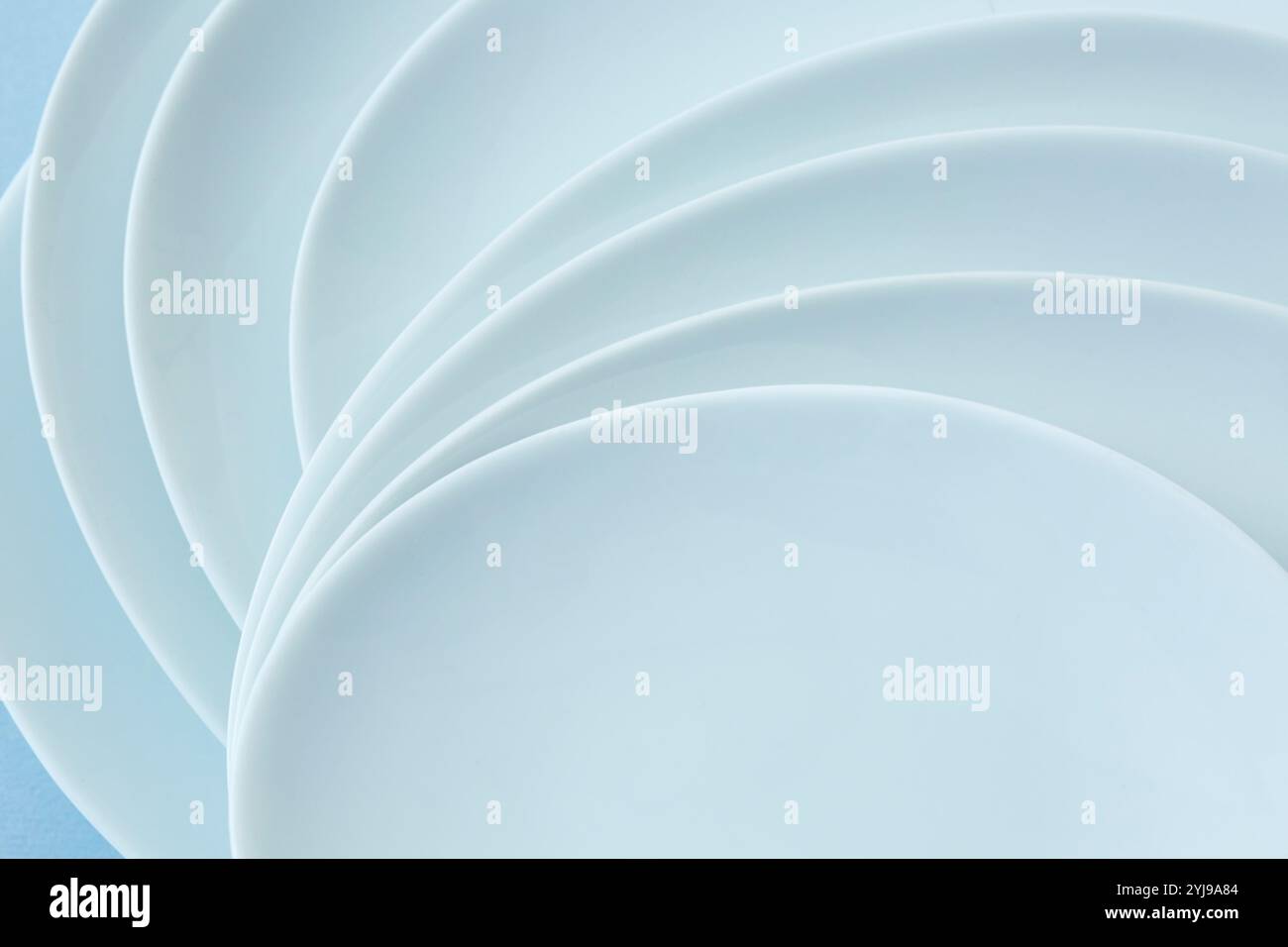 Stacked white plates Stock Photo - Alamy