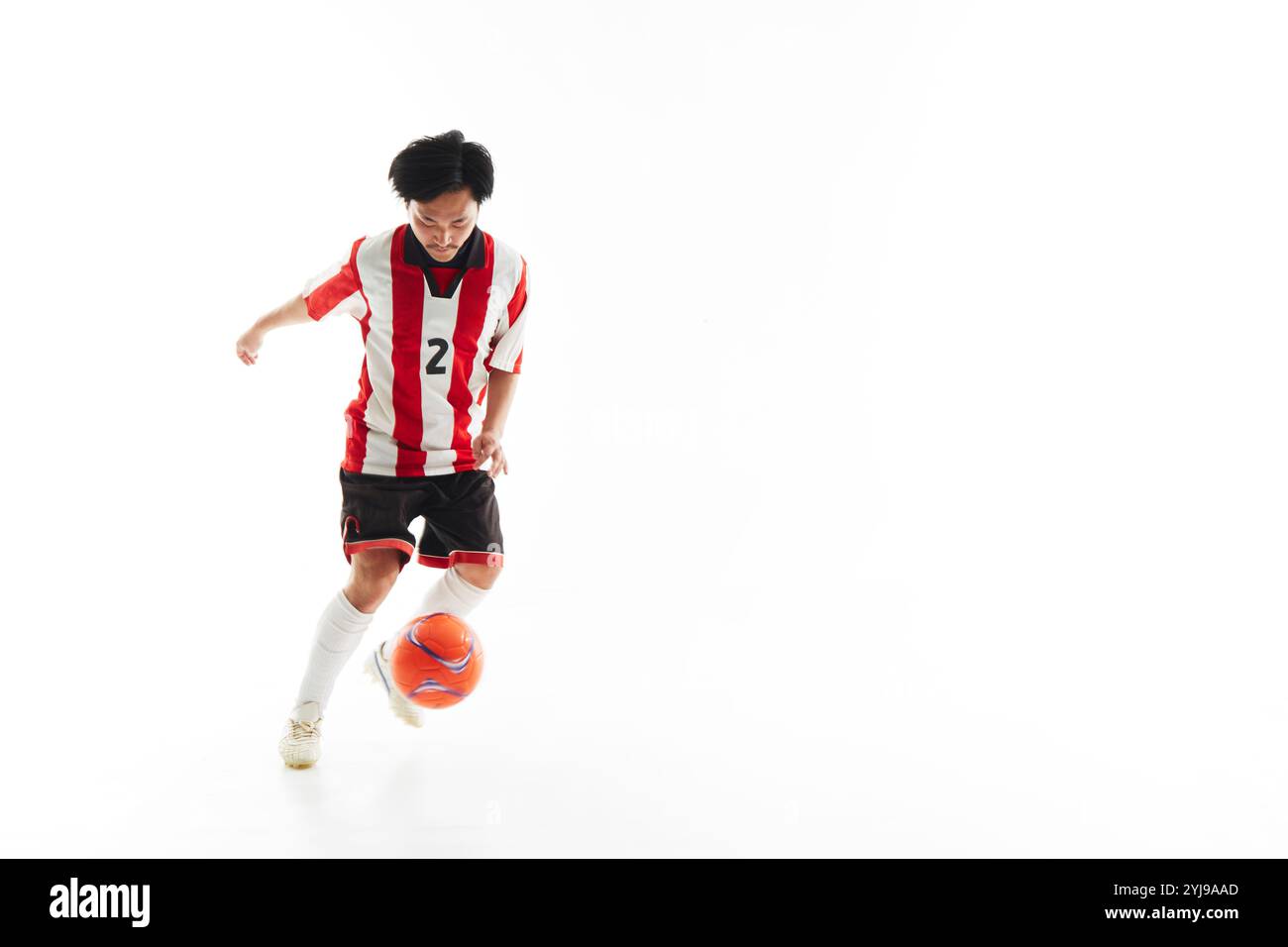 Footballer receiving a pass Stock Photo - Alamy