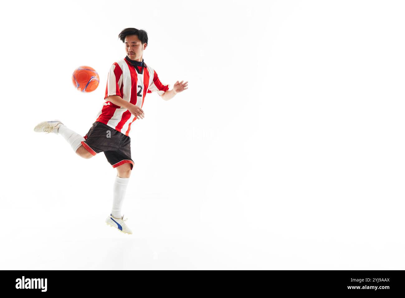 Footballer receiving a pass Stock Photo - Alamy