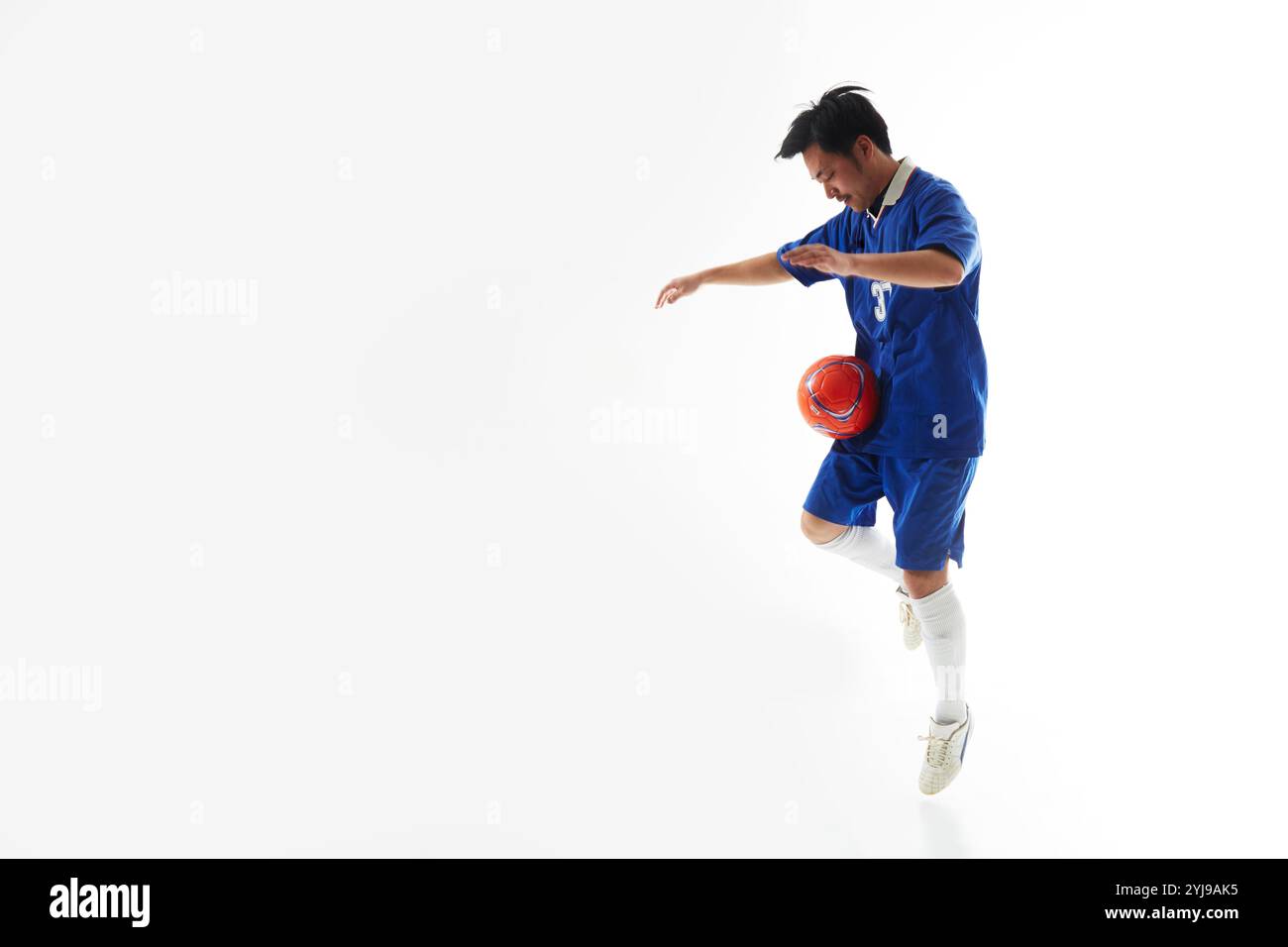 Footballer receiving a pass Stock Photo - Alamy