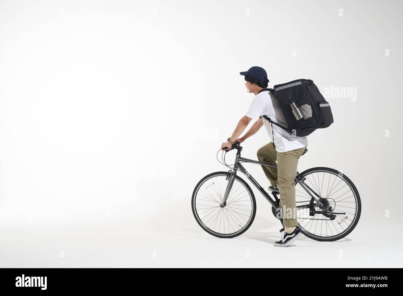 Delivery driver on bicycle hi-res stock photography and images - Alamy