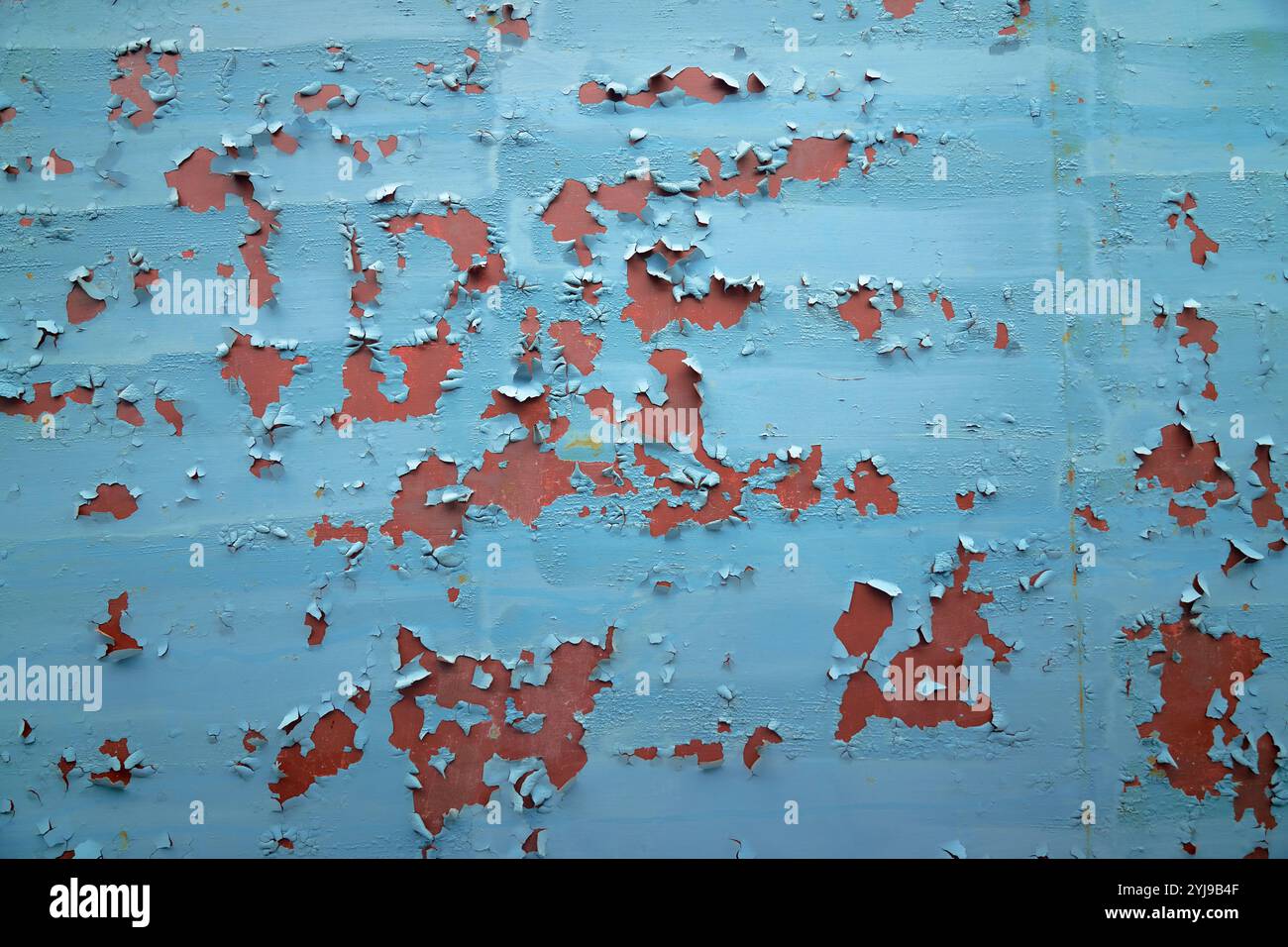 Light blue painted wall with peeling paint Stock Photo - Alamy