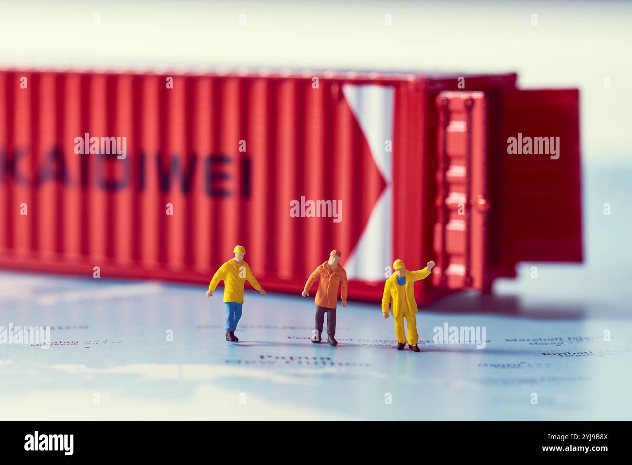 Miniature container and workers Stock Photo - Alamy